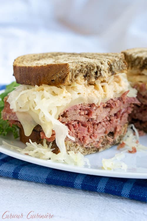 Classic Reuben Sandwich History And Recipe Curious Cuisiniere